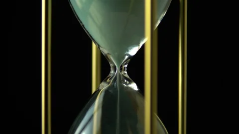 Rotating hourglass clock time concept. O... | Stock Video | Pond5