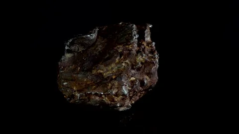 Rotating Of An Iron Meteorite. black bac... | Stock Video | Pond5