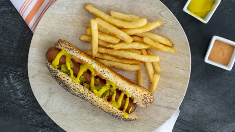 Rotating Plate of Hot Dog and French Fri... | Stock Video | Pond5