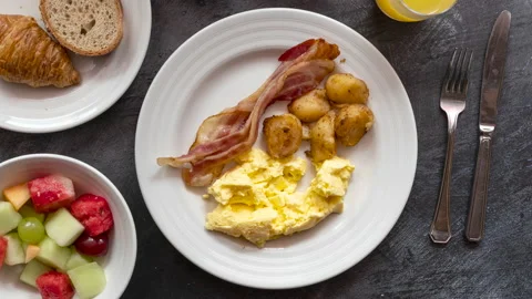 A Rotating Plate of Scrambled Eggs and B... | Stock Video | Pond5