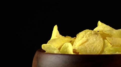 Rotating potato chips on black backgroun... | Stock Video | Pond5