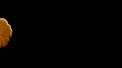 rotating pumpkin on black background wit... | Stock Video | Pond5