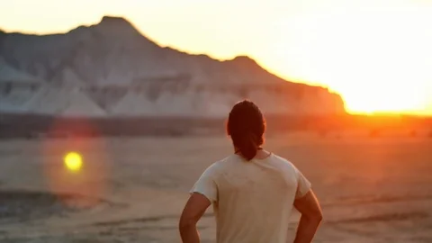A rotating shot from back of a young man... | Stock Video | Pond5
