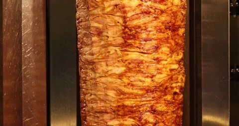 rotating spit with meat sizzling on fire... | Stock Video | Pond5