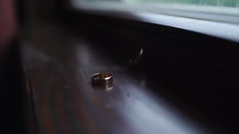 Rotating two wedding rings. Rings rotate... | Stock Video | Pond5