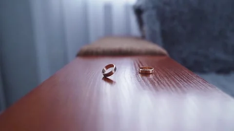 Rotating two wedding rings. Rings rotate... | Stock Video | Pond5