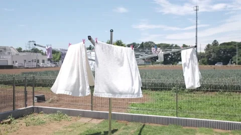 Rotating washing line on a sunny day wit... | Stock Video | Pond5