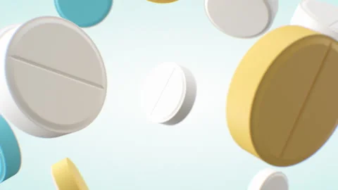 Round Colored Pills Floating Close-up Zo... | Stock Video | Pond5