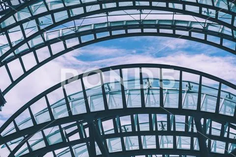 Round Metal ceiling modern architecture with blue sky in the background ...