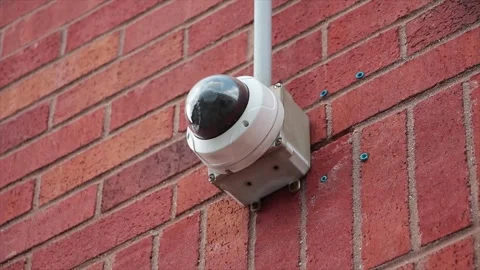 round security cctv camera mounted to br... | Stock Video | Pond5