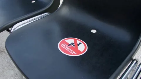 Round Sticker on Black Plastic Chair wit... | Stock Video | Pond5