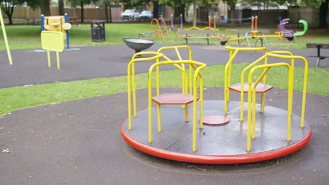 A roundabout in an empty playground spin... | Stock Video | Pond5