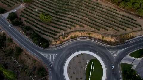 Roundabout traffic of cars on a circular... | Stock Video | Pond5