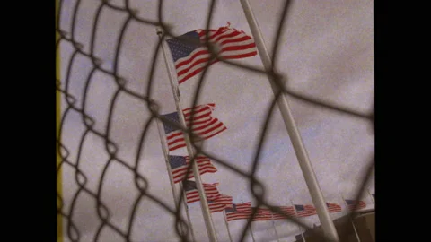 Row Of American Flags Behind Chainlink F... | Stock Video | Pond5