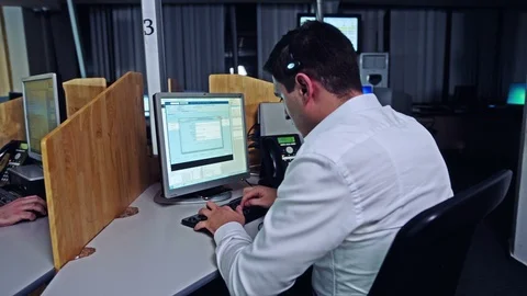 Row of call center operators at work. Cu... | Stock Video | Pond5