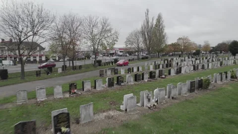 Row of graves along pathway on Ripplesid... | Stock Video | Pond5