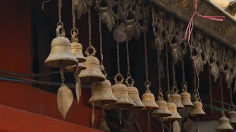 Row of hanging brass wind bells outside ... | Stock Video | Pond5