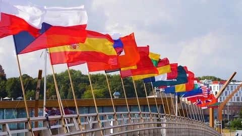 A row of international flags flying in t... | Stock Video | Pond5