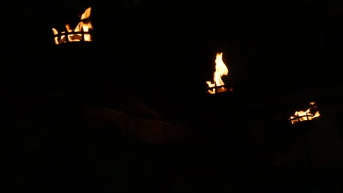 Row of three fire flames in medieval tor... | Stock Video | Pond5