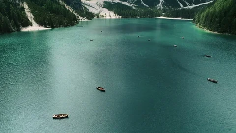 Rowing boats floating on a famous alpine... | Stock Video | Pond5
