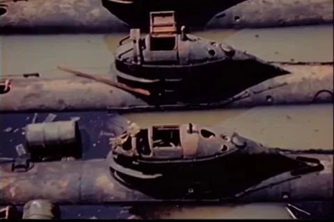 Rows of 2-man midget submarines in the d... | Stock Video | Pond5