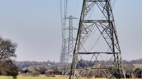 Rows of High Voltage Lattice Power Line ... | Stock Video | Pond5