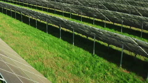 Rows of solar cells built on grass gener... | Stock Video | Pond5