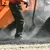 Workers Apply Asphalt to Road Constructi... | Stock Video | Pond5