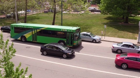 RTA bus in intersection traffic at light... | Stock Video | Pond5