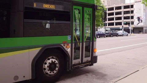 RTA bus stopped at station in downtown D... | Stock Video | Pond5