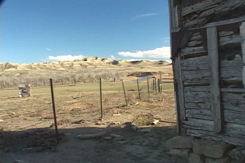 Rugged Hills above Farm Field and Rundow... | Stock Video | Pond5