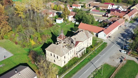 Ruined medieval castle in a small villag... | Stock Video | Pond5