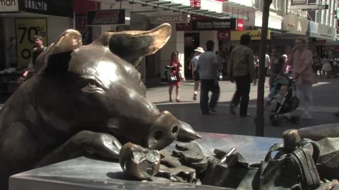 Rundle Mall pig statue sniffing rubbish ... | Stock Video | Pond5