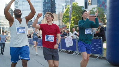 Runners Crossing Finish Line in Marathon | Stock Video | Pond5