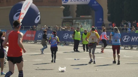 Runners reaching the finish line in a ma... | Stock Video | Pond5