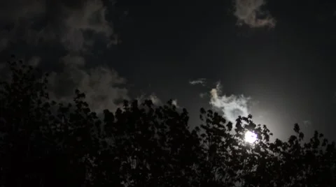 Running clouds at night under the moonli... | Stock Video | Pond5