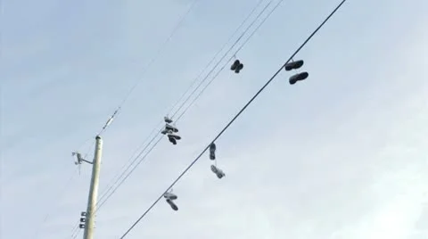 Running Shoes Hanging From Hydro Wires | Stock Video | Pond5