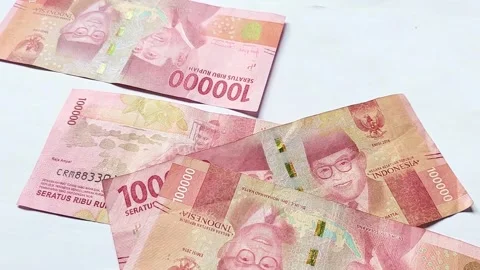 Rupiah banknotes falling on a white back... | Stock Video | Pond5