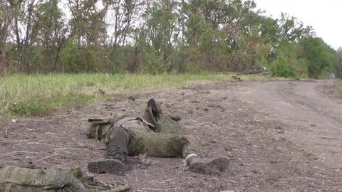 Russian soldiers' corpses line road into... | Stock Video | Pond5