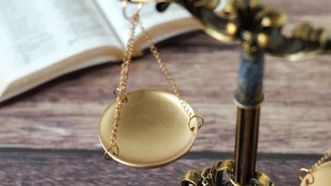 Rustic golden balance scale with holy bi... | Stock Video | Pond5