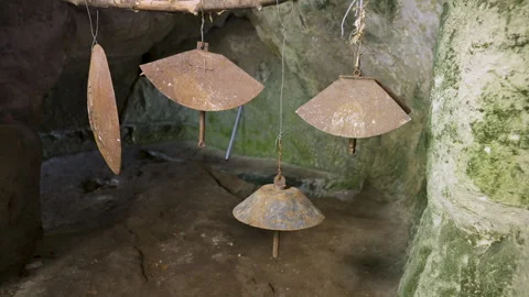 Rustic metal bells hanging inside ancien... | Stock Video | Pond5