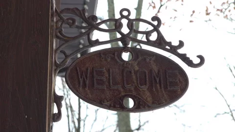A rusty cast-iron welcome sign on the ex... | Stock Video | Pond5