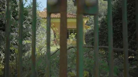 Rusty locked gate reveals abandoned graf... | Stock Video | Pond5