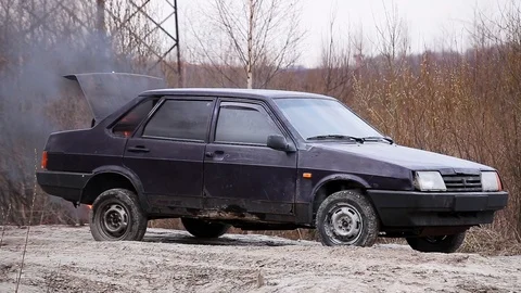 Rusty old dusty dark car is left on dese... | Stock Video | Pond5