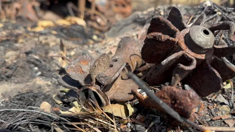 Rusty parts from exploded ammunition, un... | Stock Video | Pond5