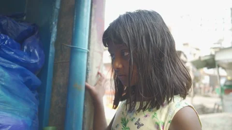 Sad and poor Asian dark skin girl stands... | Stock Video | Pond5