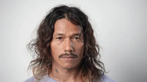 Sad asian man with long wavy curly hair.... | Stock Video | Pond5