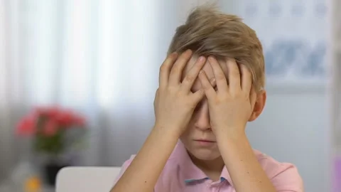 Sad boy tired of complicated homework, f... | Stock Video | Pond5
