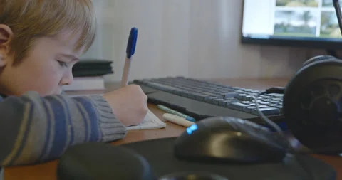 Sad Child Boy Study at Home. Kid Write ... | Stock Video | Pond5