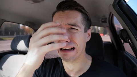 Sad desperate man crying in the car | Stock Video | Pond5
